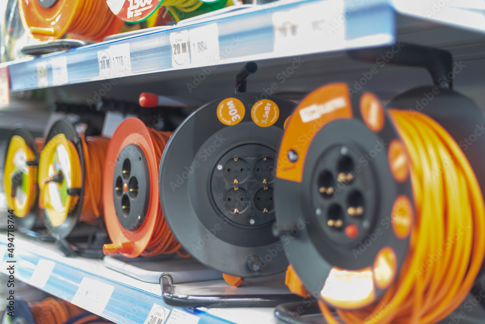Electrical extension cords (wires) on a shelf in a store. Stock Photo ...