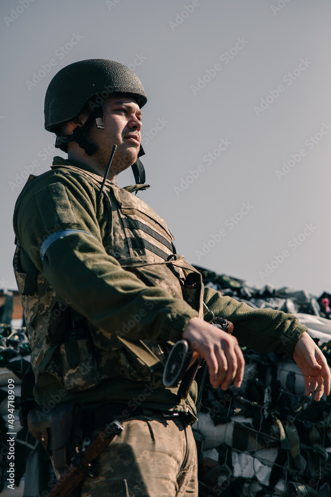 Ukrainian territorial defense warrior stands on checkpoint in body ...