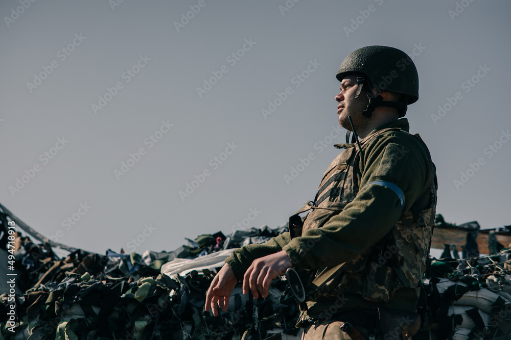 Ukrainian territorial defense warrior stands on checkpoint in body ...