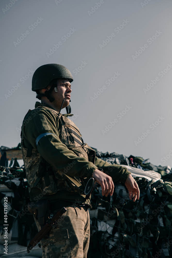 Ukrainian territorial defense warrior stands on checkpoint in body ...