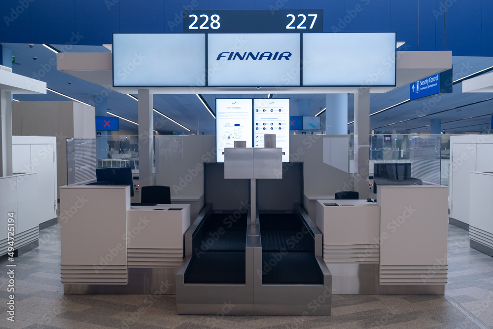 Check-in counter for the Finnish flag carrier Finnair at Helsinki ...