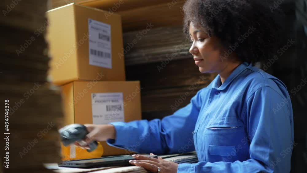 Selective focus, oblique angle of a smiling African female factory ...