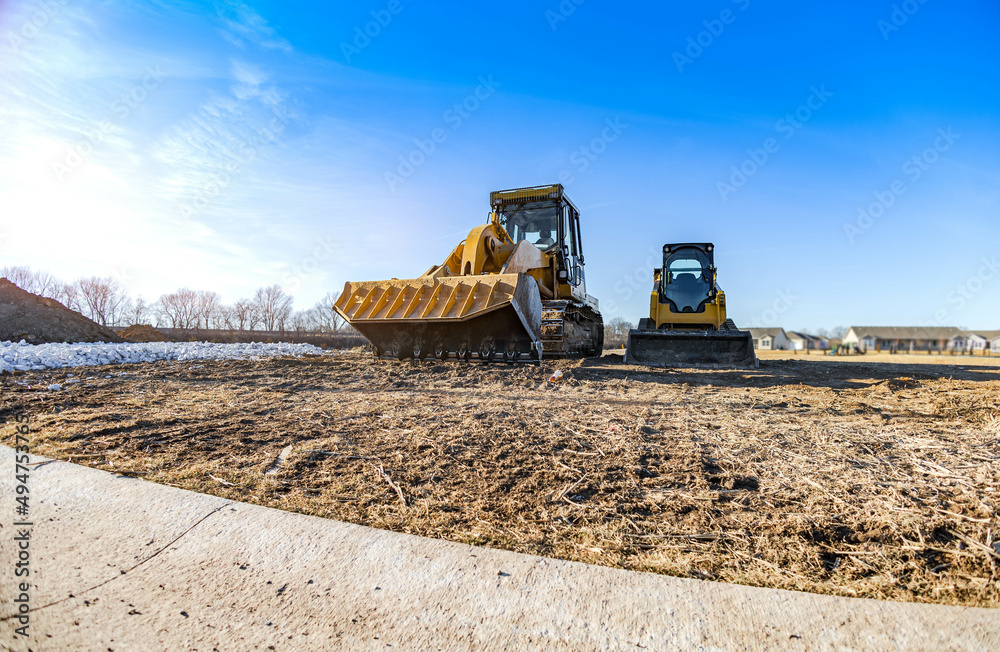 Track bulldozer, earth-moving equipment at construction site with ...