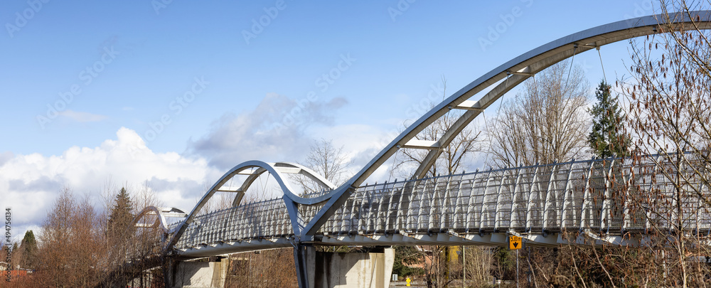 Pedestrian bridge across Trans Canada Highway in modern city suburbs ...