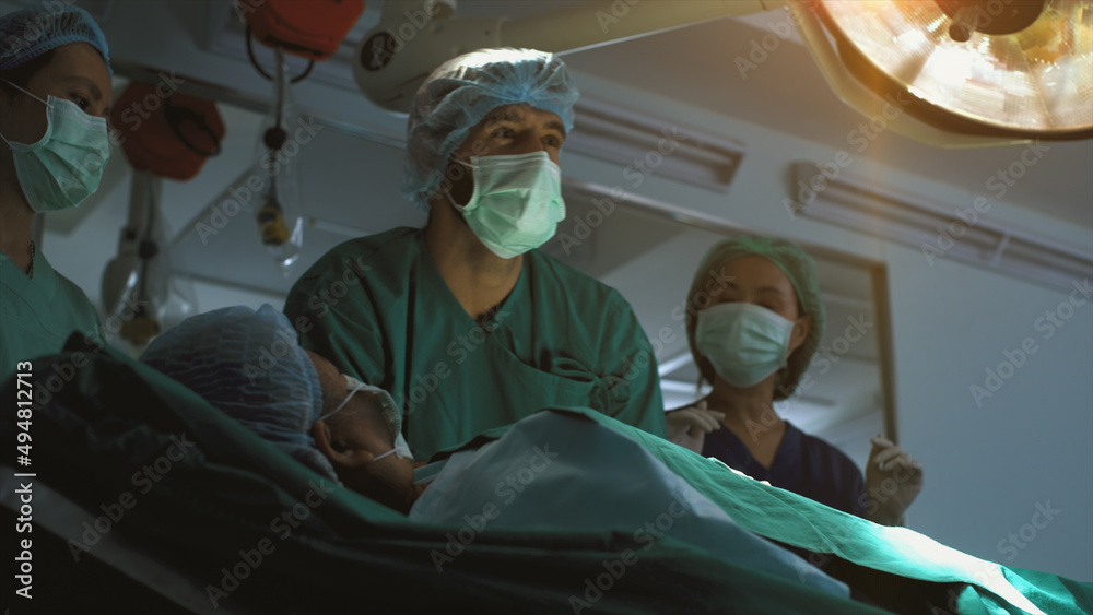 Futuristic operating room simulation - a surgeon diagnosing a senior ...