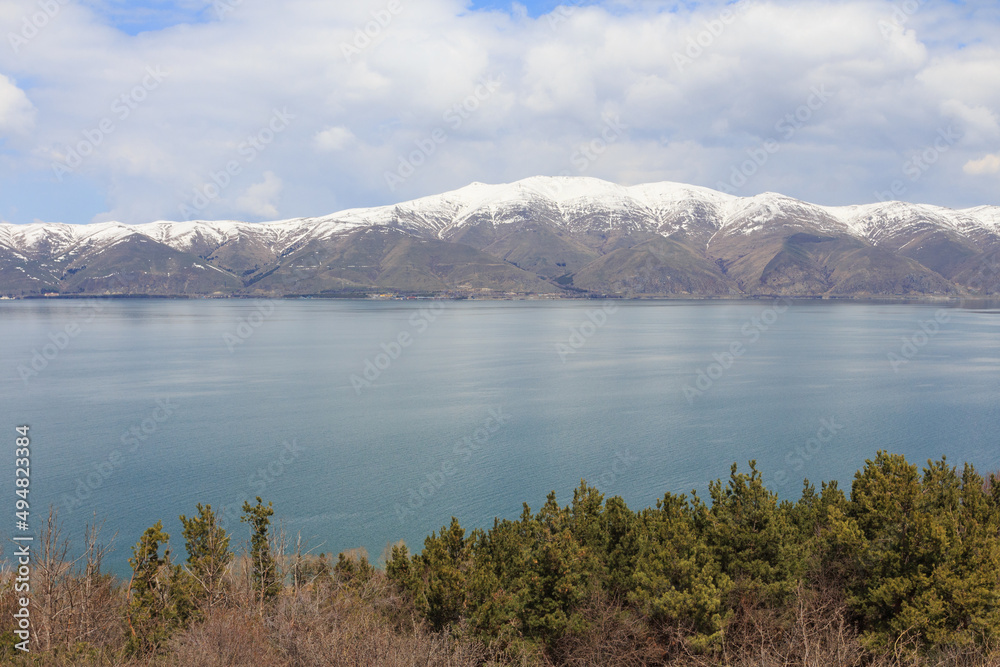 View of Lake Sevan and the snow-capped peaks around it in Armenia. Stock Photo | Adobe Stock