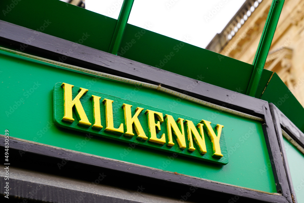 kilkenny irish beer sign text and brand logo front of windows building ...