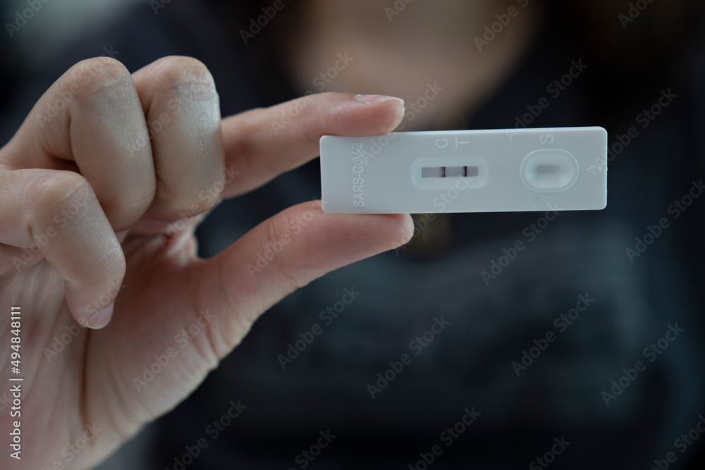 Test kit with Positive result during swab COVID-19 testing. Coronavirus ...