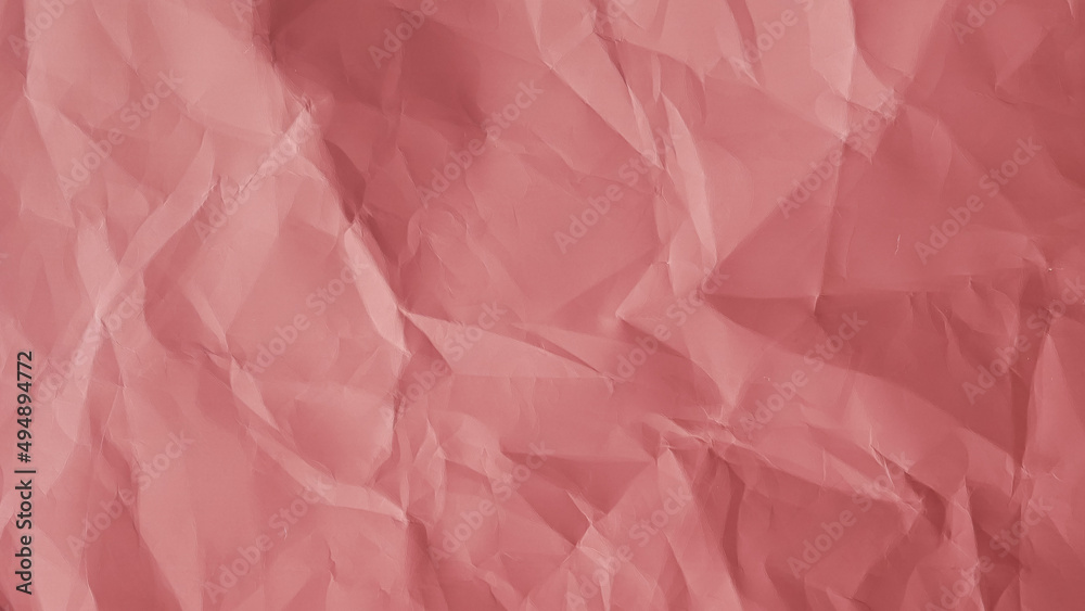 Pink crumpled paper texture for background with copy space for image or ...