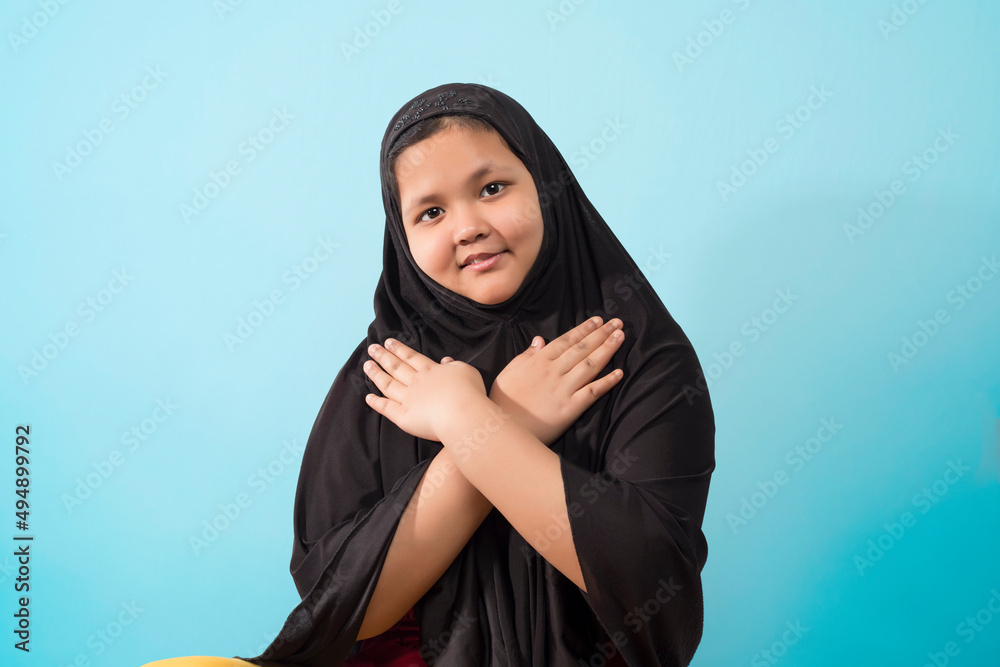 girl wearing traditional islamic hijab scarf hands on chest with ...
