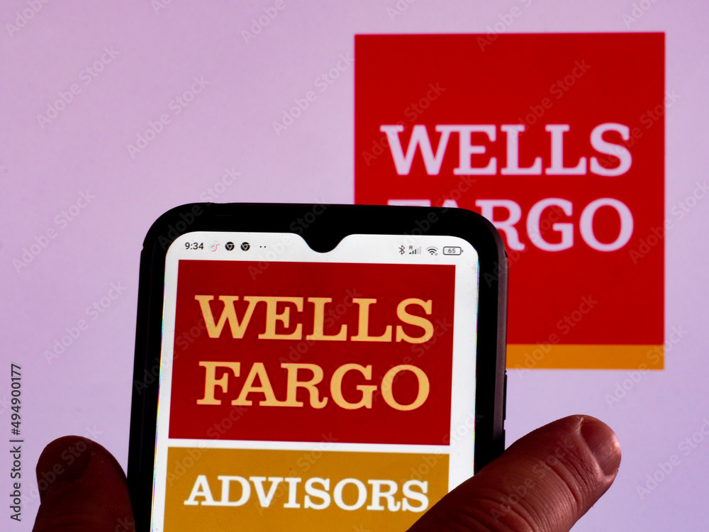 In this photo illustration, the Wells Fargo Advisors logo is displayed ...