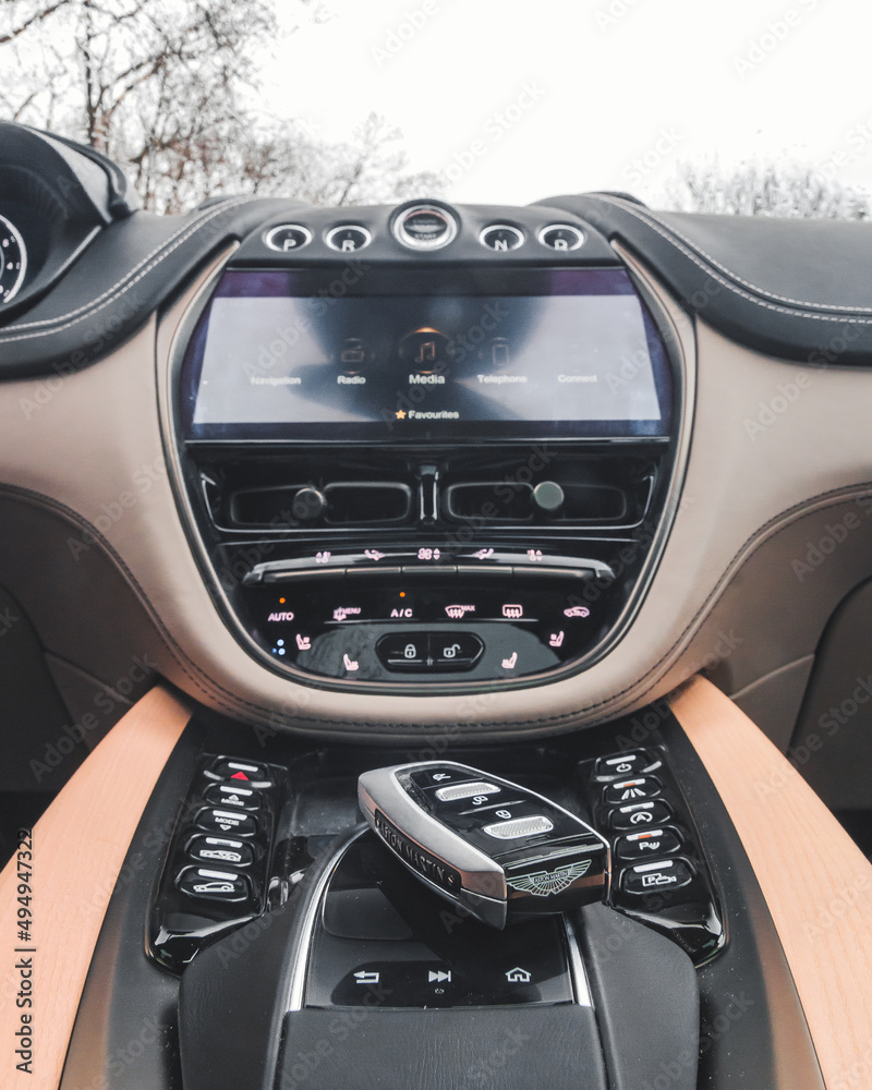 Aston Martin DBX SUV shot of middle section, infotainment , key, menu ...