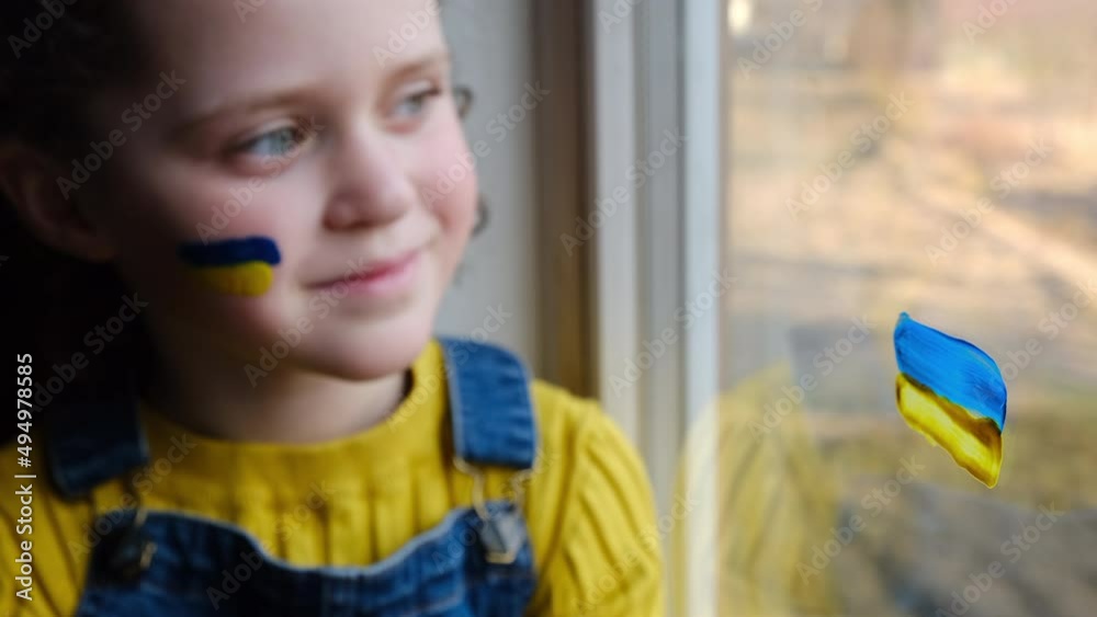 Selective focus of cute smiling ukrainian little girl child with ...