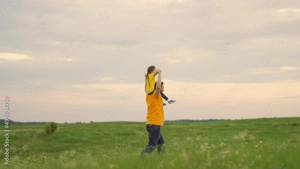 Happy family running in park. Kid, daughter plays superhero with father ...