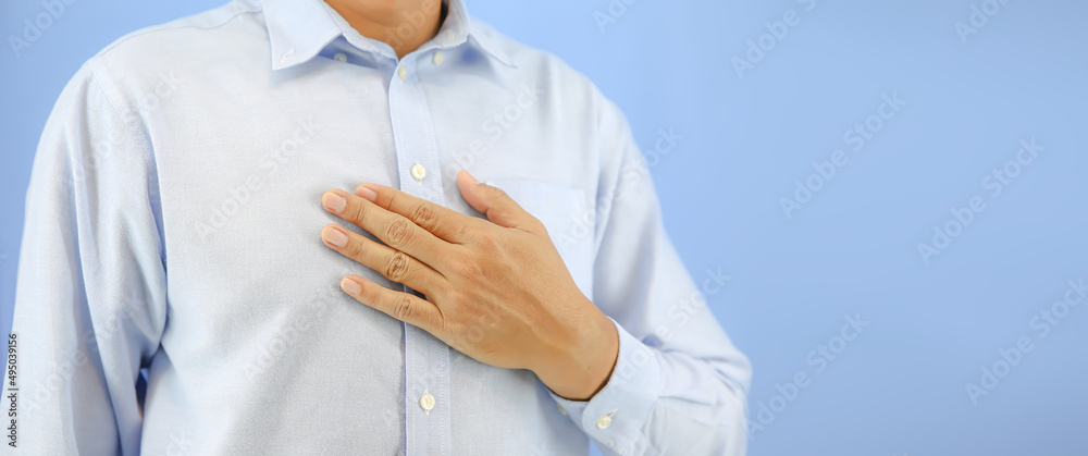 Hand holding the chest concepts of burning chest pain or sensation in ...