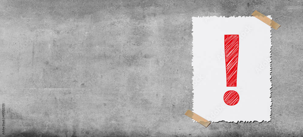 Note paper with exclamation mark on textured concrete wall background ...