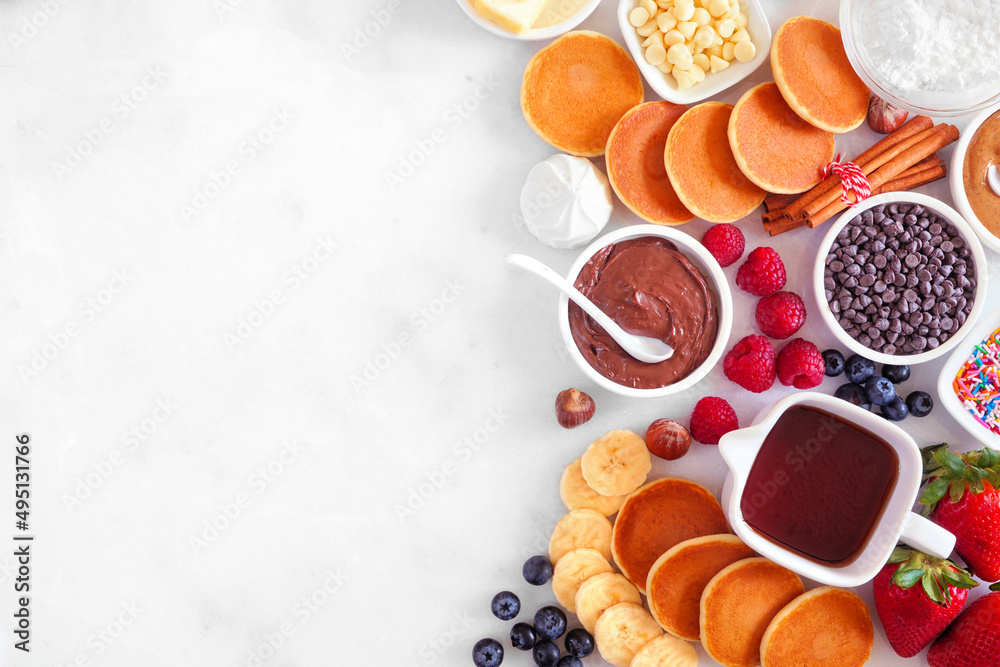 Breakfast or brunch pancake buffet side border. Top view on a white ...