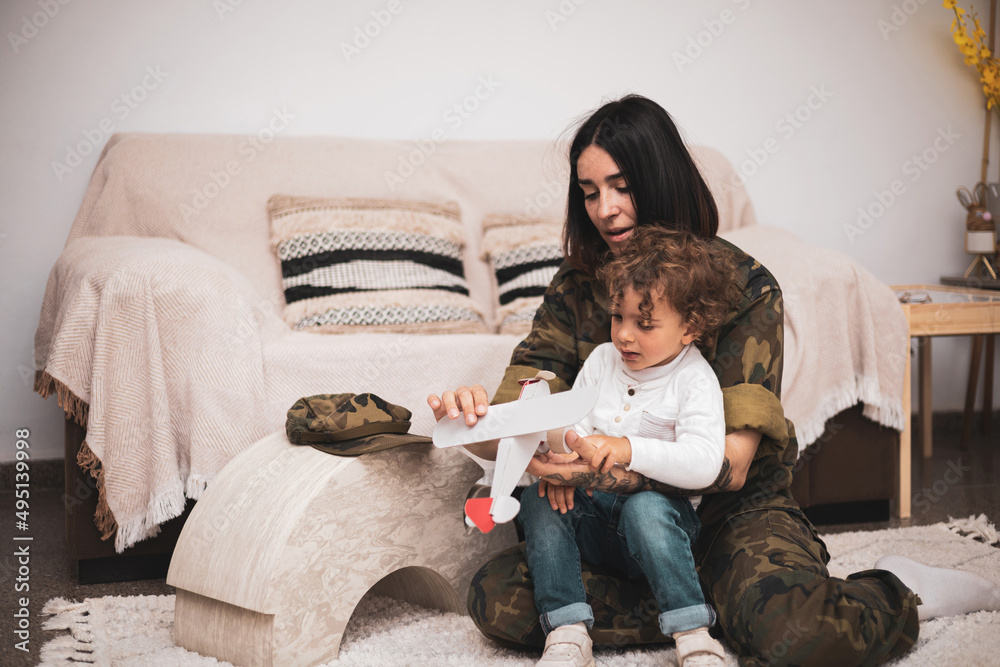 A female soldier returns home from war. The mother brings a gift to her ...