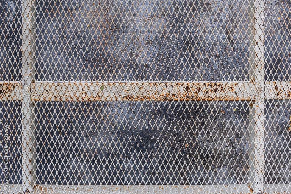 A metal grid background was used to create a high-altitude walking ...