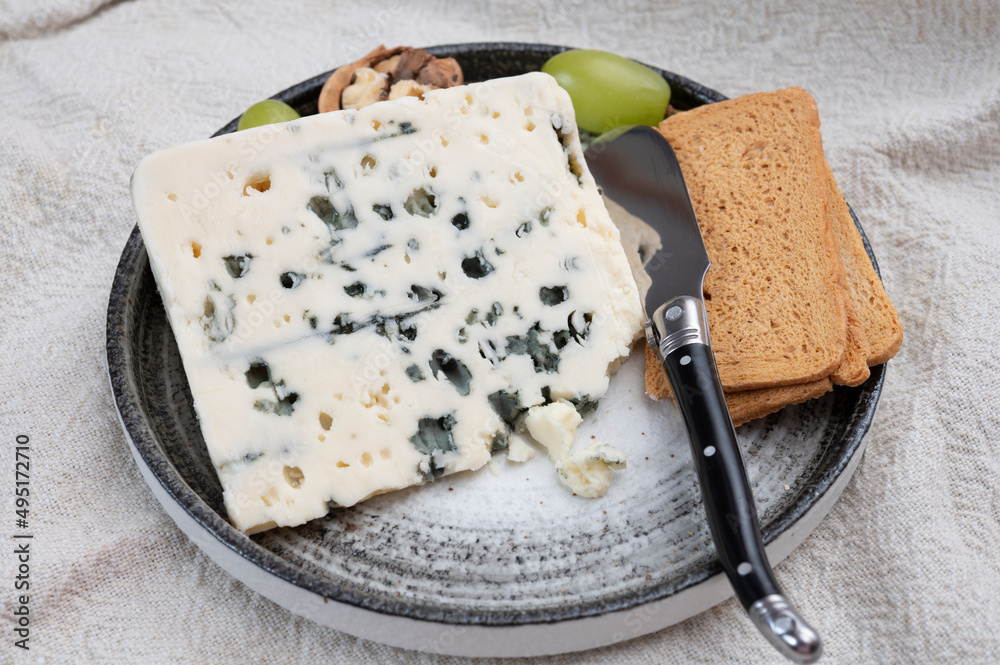 Tastig of French king of cheeses, sheep milk blue cheese roquefort from ...