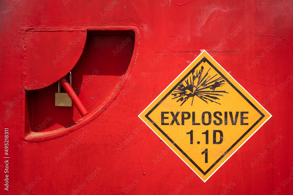 An explosive material placard symbol on the metal container box with ...