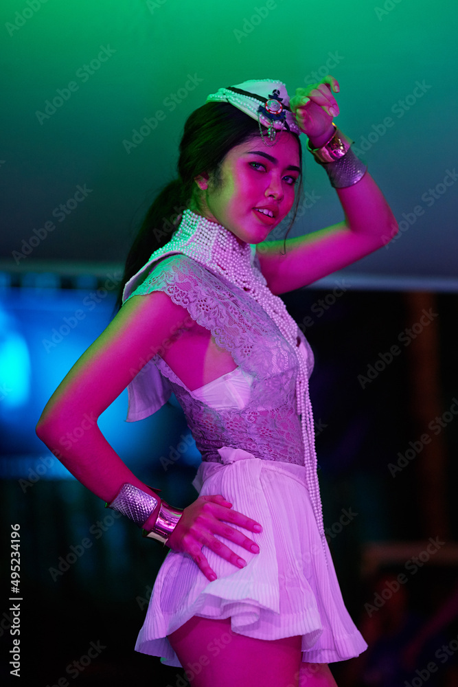 The wrong kind of nightlife. Shot of a bar girl dancing on a stage in a ...