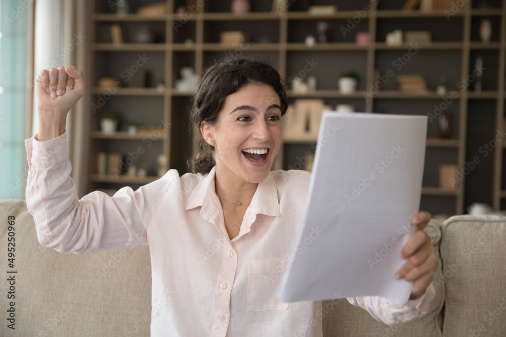 Overjoyed cheerful student girl getting good news mail, reading ...