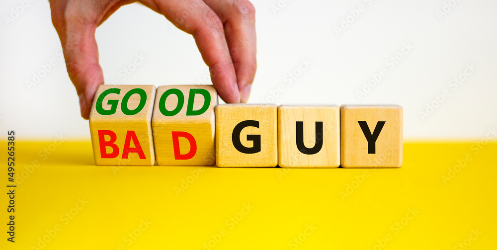 Good or bad guy symbol. Businessman turns cubes and changes concept ...