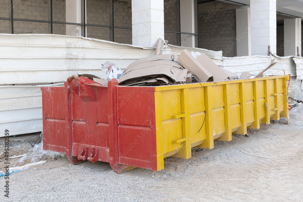 a huge heap of waste in a Big Overloaded dumpster waste metal container ...