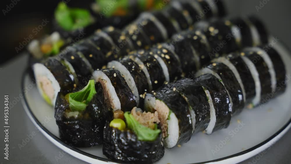 Traditional Korean food Gimbap - Plating Tuna Kimbap Made with Steamed ...
