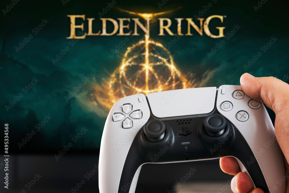 Man holding a Playstation 5 Dual Sense Controller with Elden Ring game ...