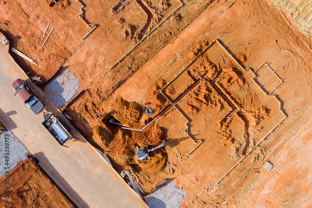 Aerial view of a bulldozer work at new construction installation on ...