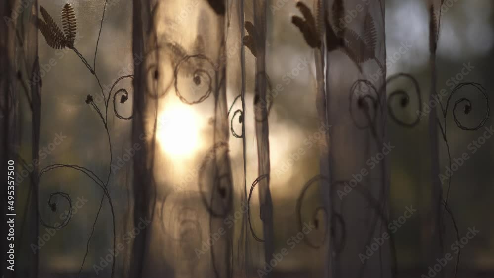 Wind blows through the open window in the room. Waving white tulle near ...