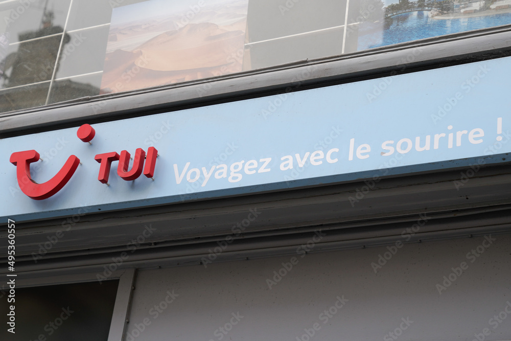 TUI logo brand and text blue smiling sign of facade office travel ...