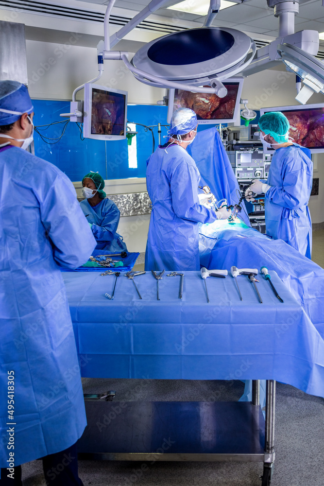 Hospital operating theatre medical healthcare team performing operation ...