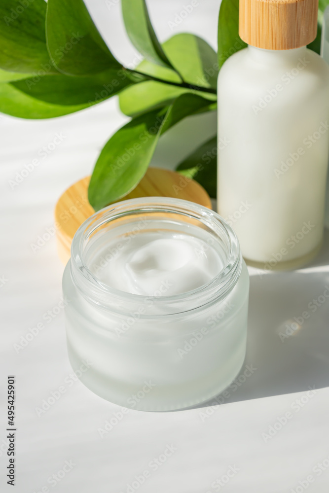 Natural cosmetics set. Moisturizing cream in eco-friendly glas jar with ...