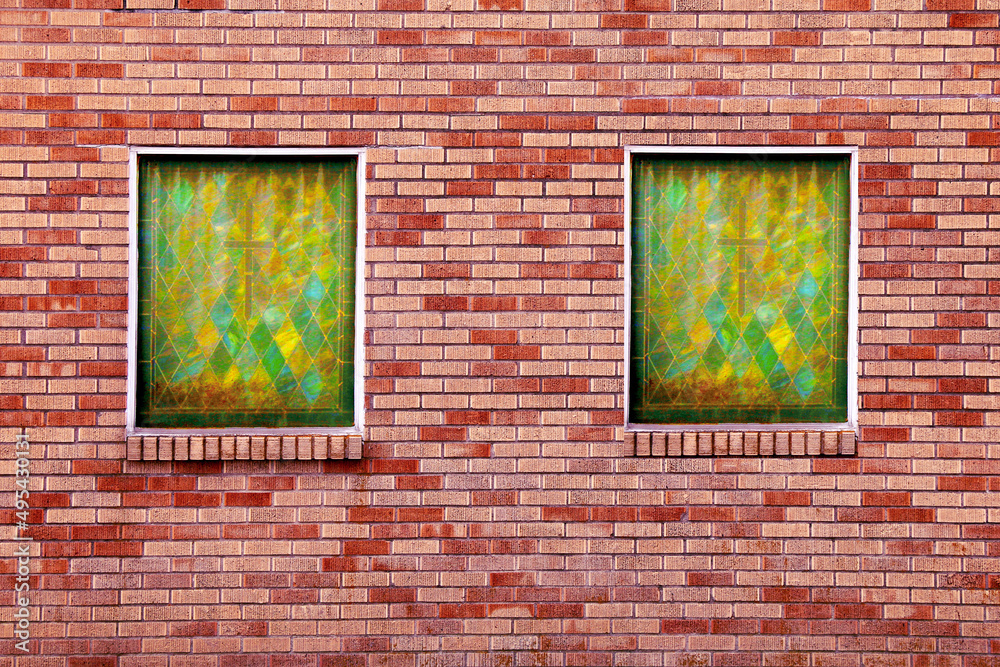 red brick church building wall green stained class square window cross ...