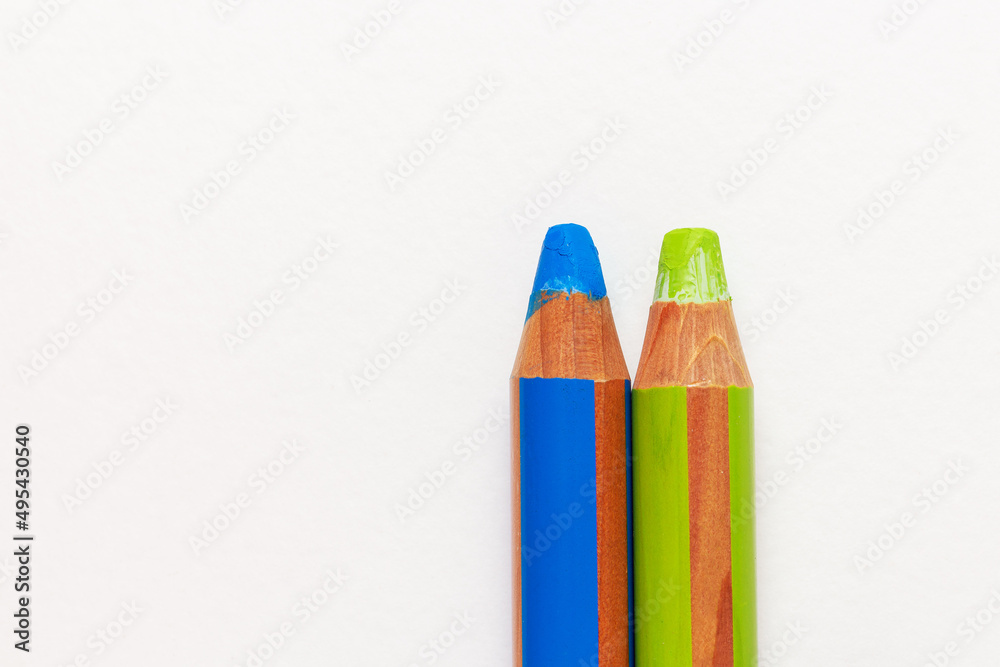Two large thick colored pencils in green and blue for children Stock ...