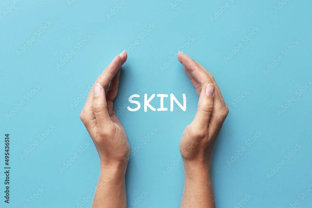 Word: skin in human hands. Symbol of protection of human skin from ...
