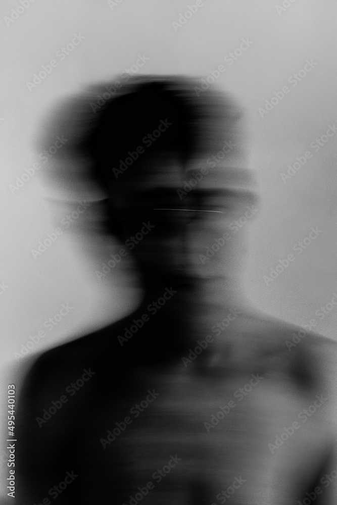 Grayscale blurry portrait of topless man against light background Stock ...