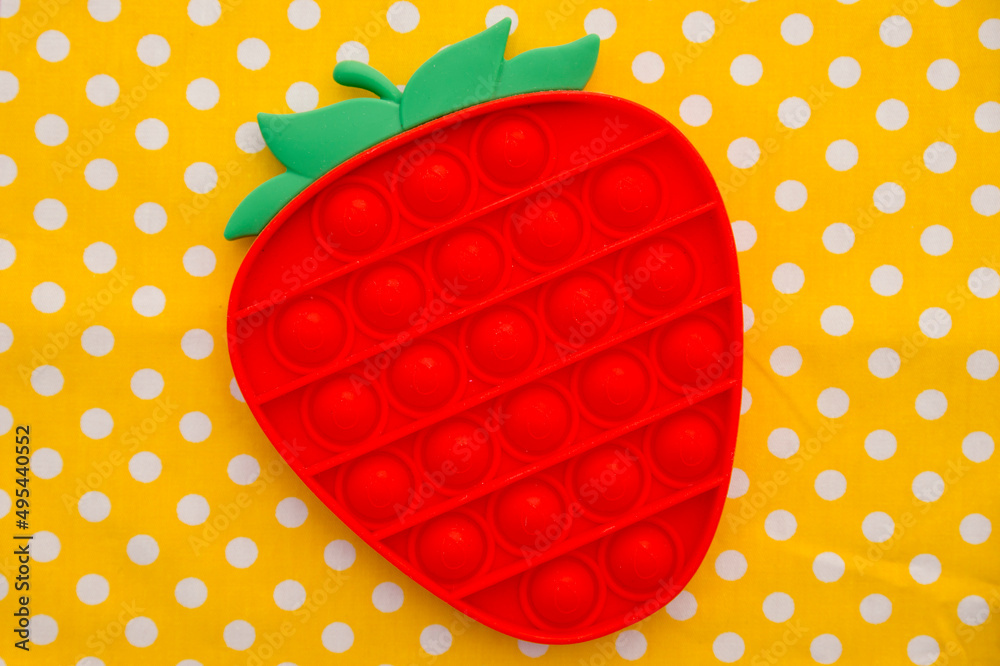 Sensory fidget toy "Pop-it". Instrument for fine motoric skils, tool to ...