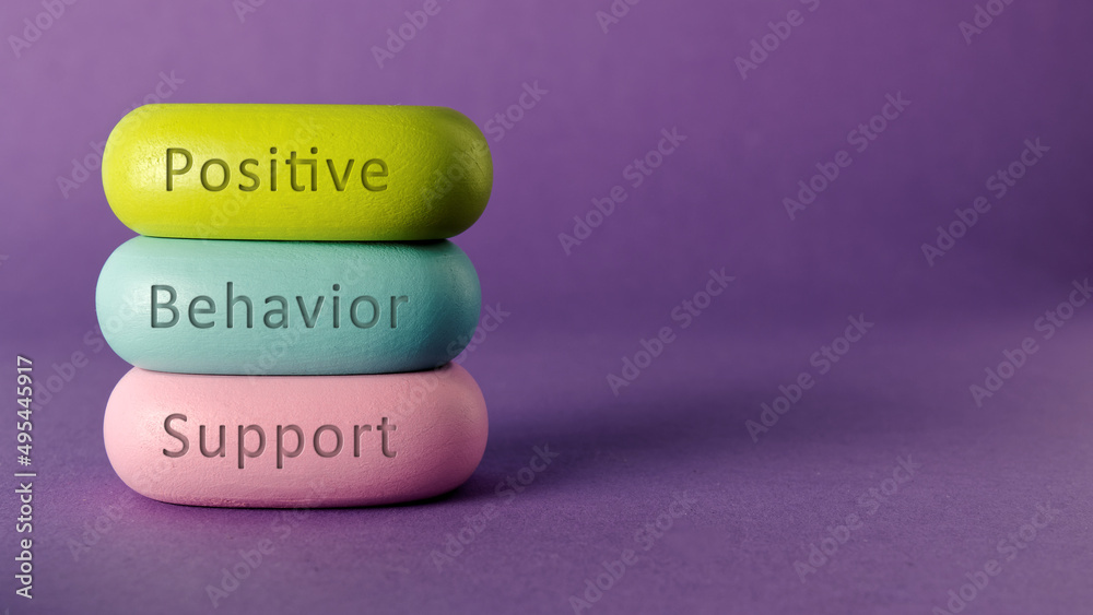 Positive behavior support words written on colorful wooden blocks ...