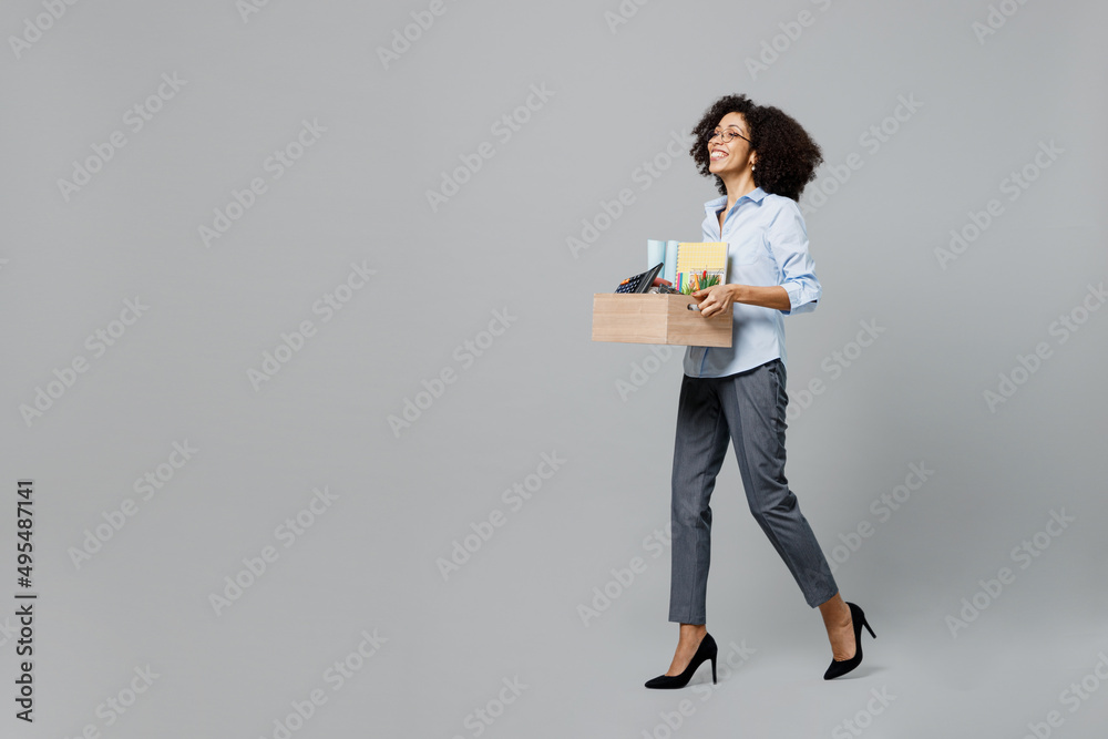Full body side view happy young employee business corporate lawyer woman of African American ...