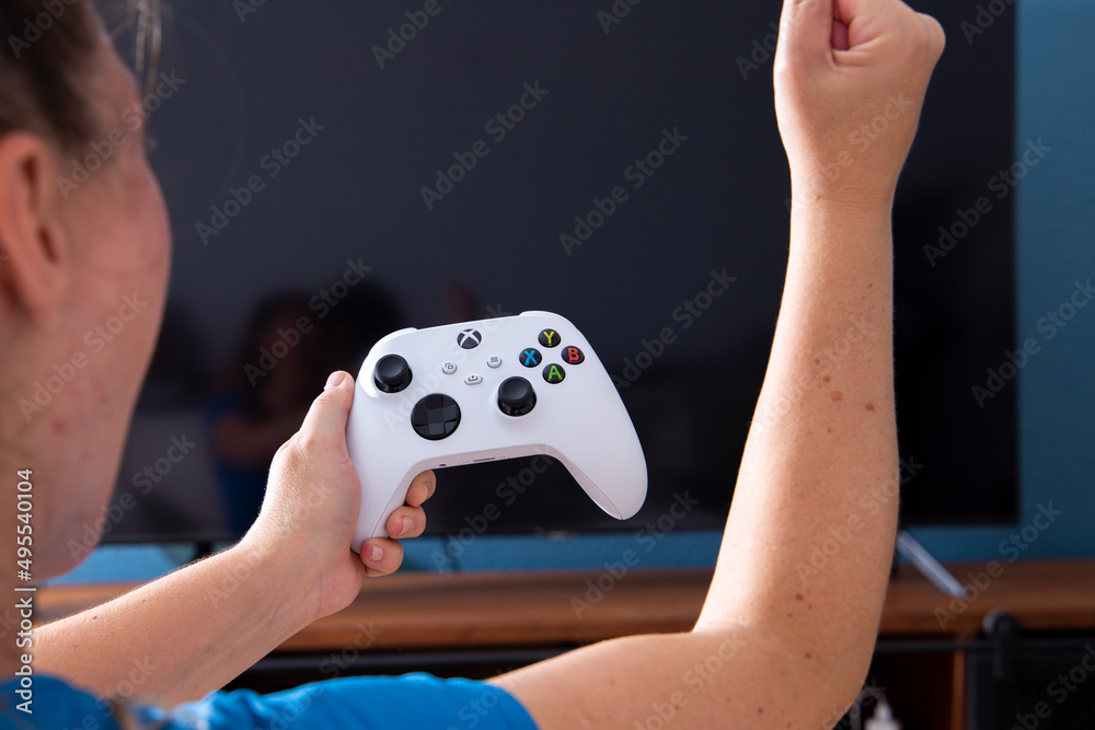 São Paulo, Brazil - 03, 2022: Girl playing the new video game console ...