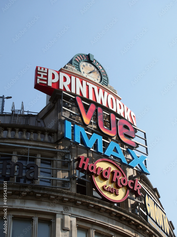 manchester, united kingdom - 24 march 2022: signs and clock on the ...