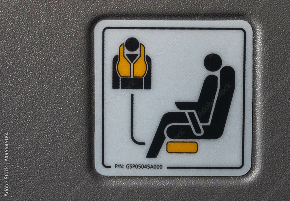 Life jacket under your seat sign in an aircraft ภาพถ่ายสต็อก | Adobe Stock