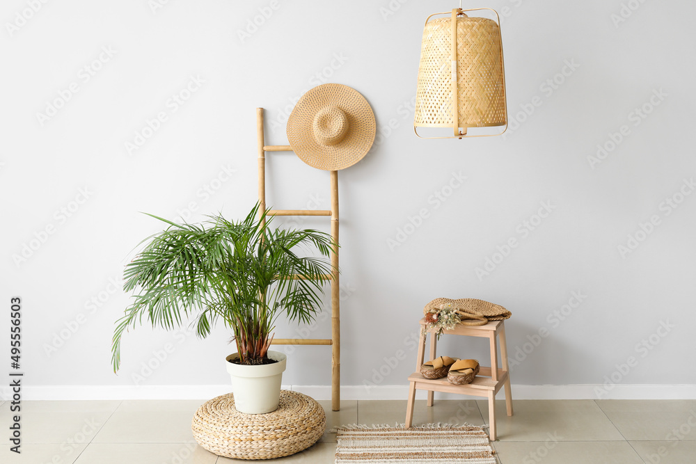 Interior of light room with hanging lamp, ladder and step stool Stock ...