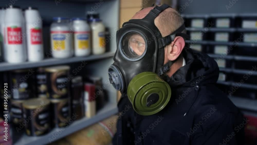 Doomsday prepper sitting in a fallout bunker wearing a gas mask and ...