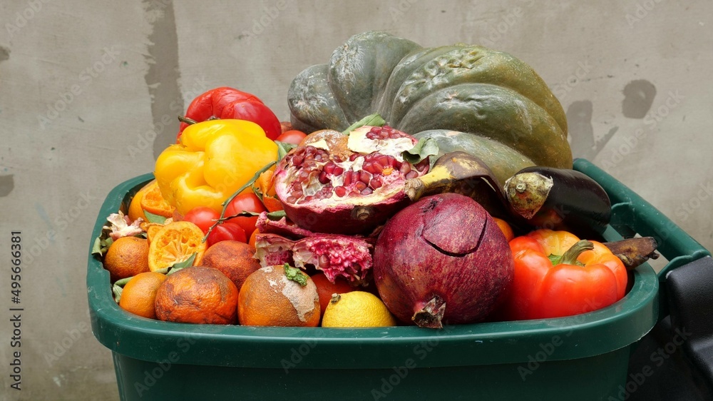 Food Waste in Grocery Store Retail. Discarded unsold damaged fruits and vegetables in packages ...