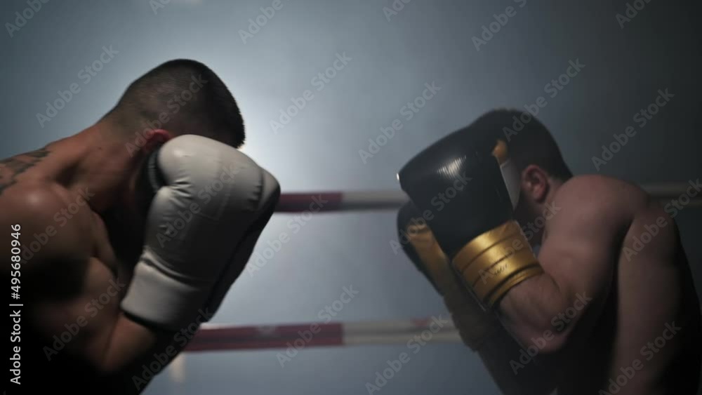 Cinematic slow motion shot of two professional young muscular shirtless ...